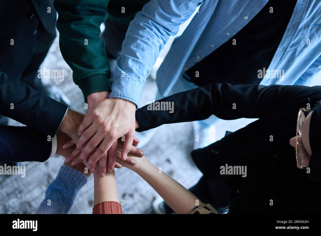 A top view photo of group of businessmen holding hands together to ...