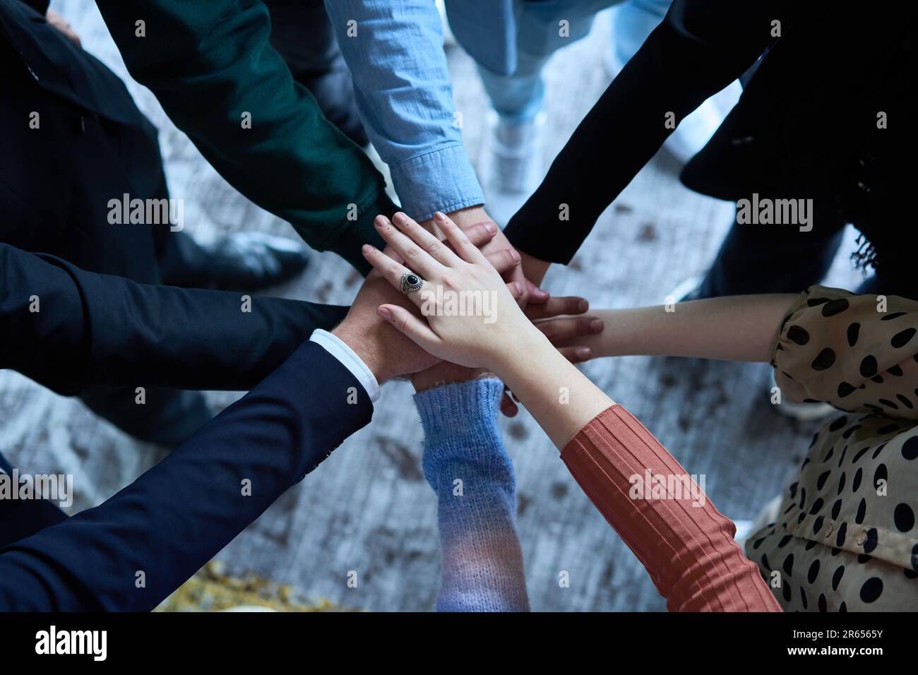A top view photo of group of businessmen holding hands together to ...