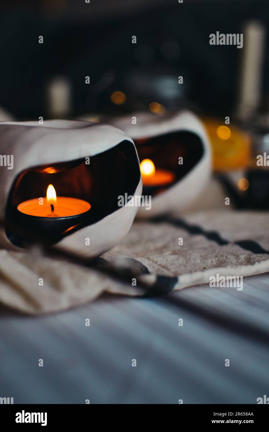 Close up warm candlelight. Conception of hygge, cozy, home interior ...