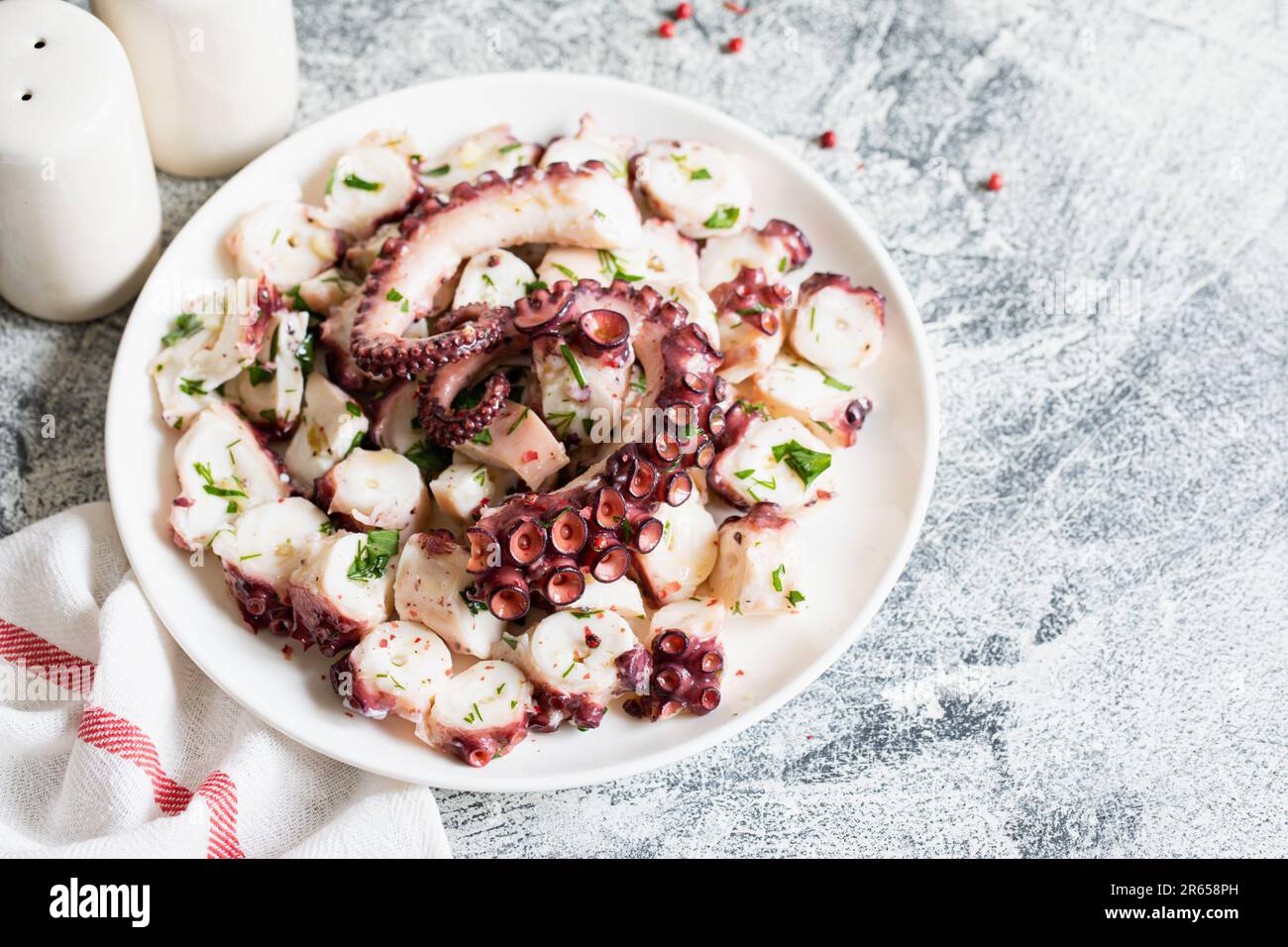 boiled chopped octopus on a concrete table Stock Photo - Alamy