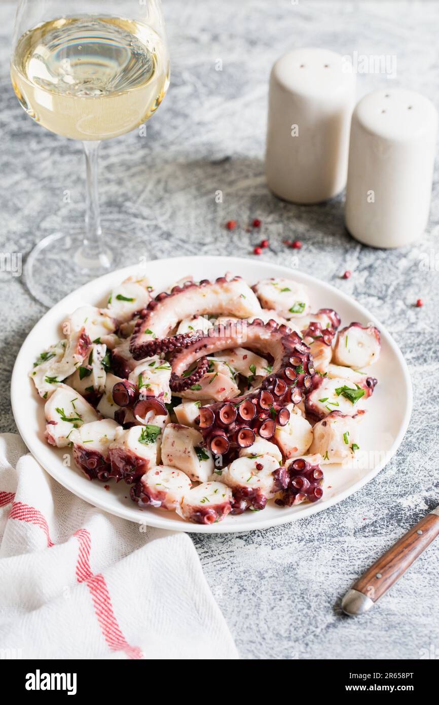 boiled chopped octopus on a concrete table Stock Photo - Alamy