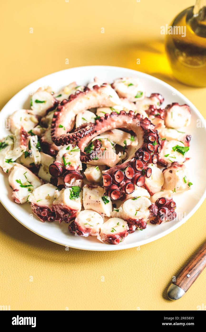 boiled chopped octopus on a concrete table Stock Photo - Alamy