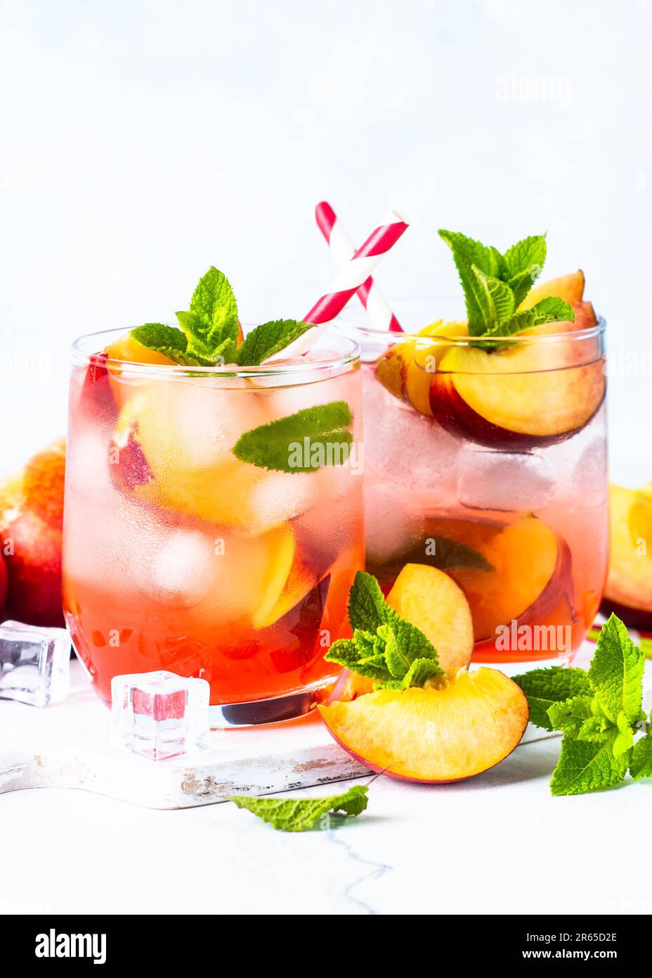 Peach cocktail, iced peach tea, fruit drink Stock Photo - Alamy