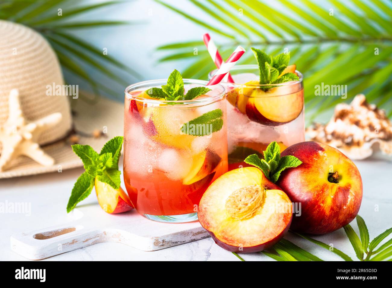 Peach cocktail, iced peach tea, fruit drink Stock Photo - Alamy