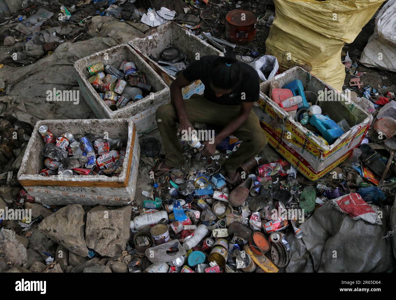 Srinagar, India. 05th June, 2023. A man collects recyclable material ...