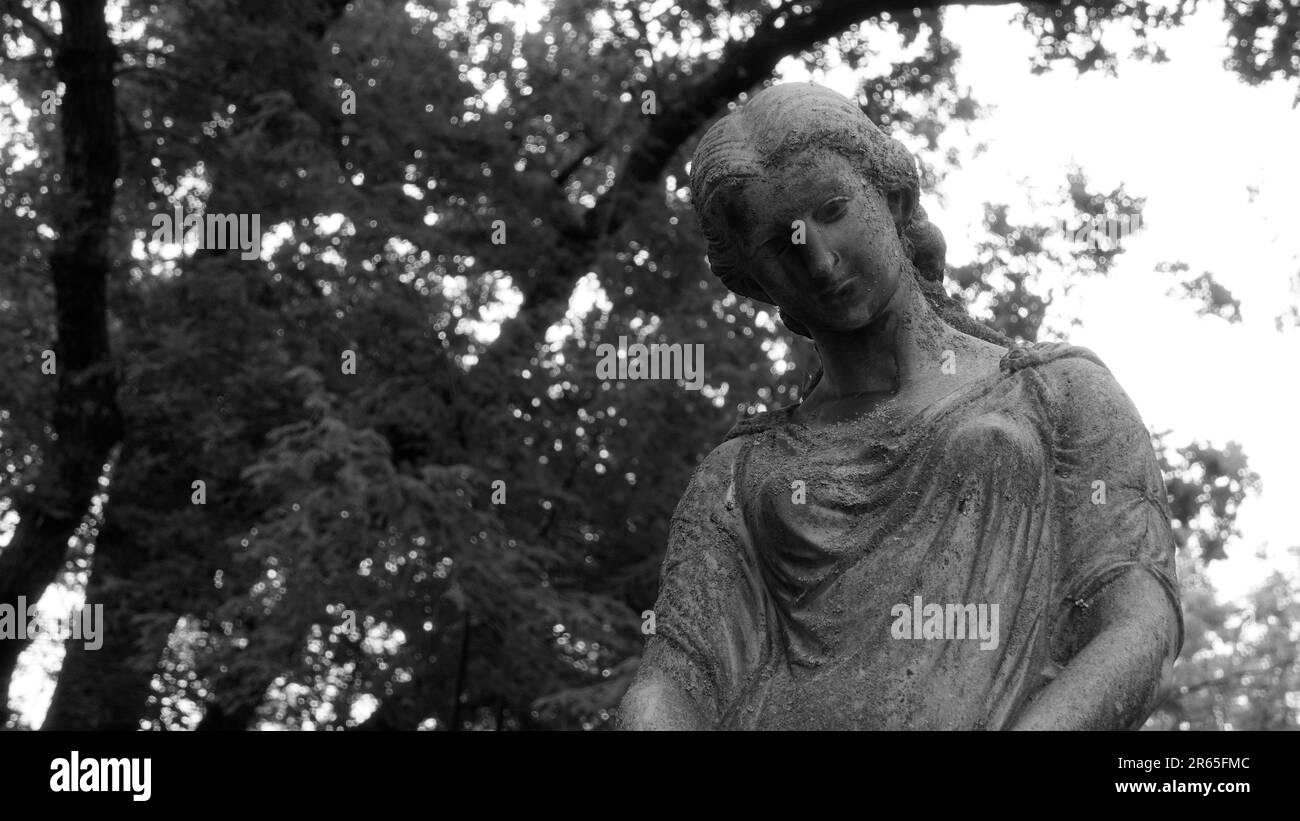 Sculpture of a beautiful woman in a graveyard / cemetery Stock Photo ...