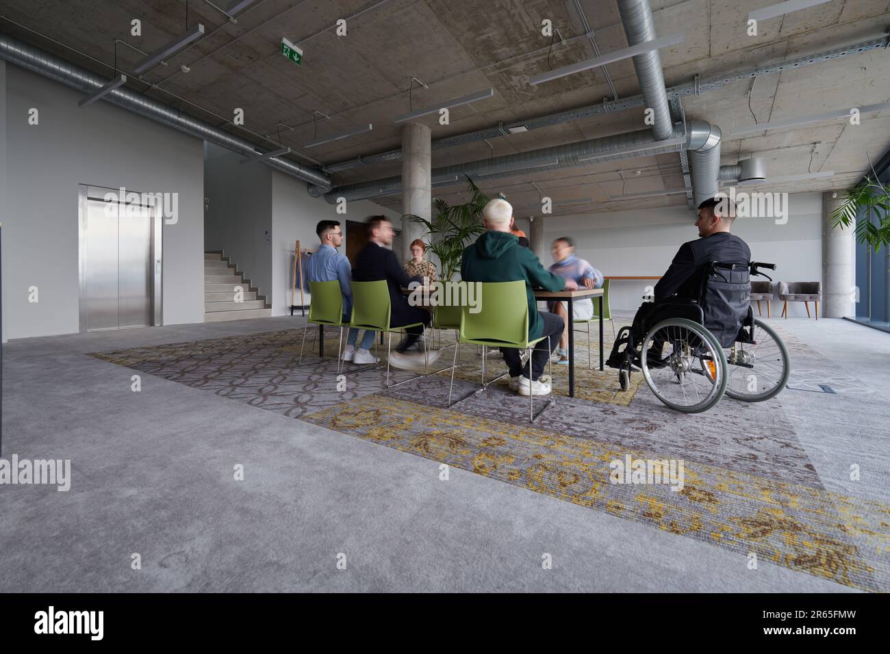 A diverse group of business professionals, including an person with a ...