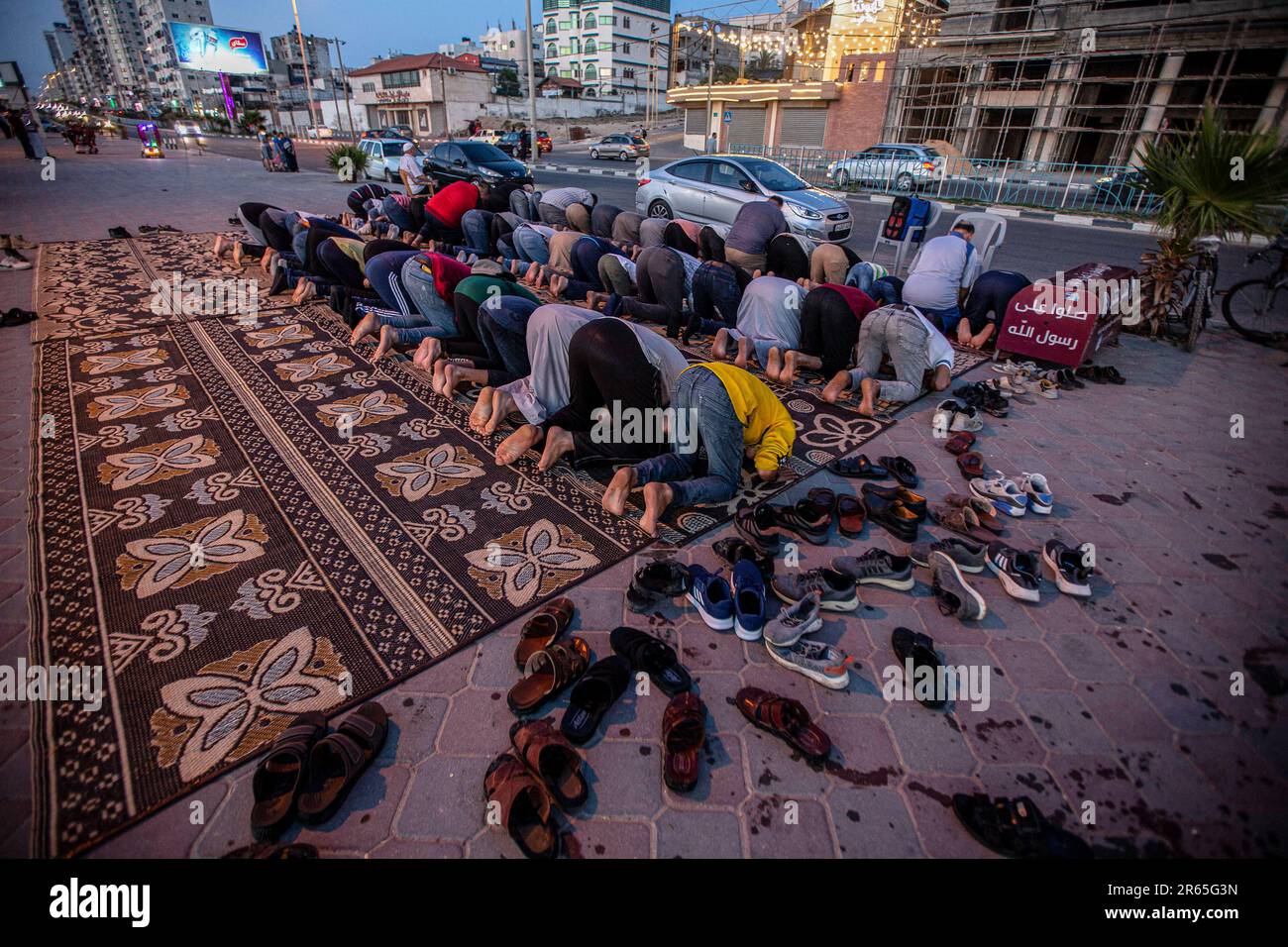 Palestinian Muslims perform maghrib prayers (sunset prayers) along the ...