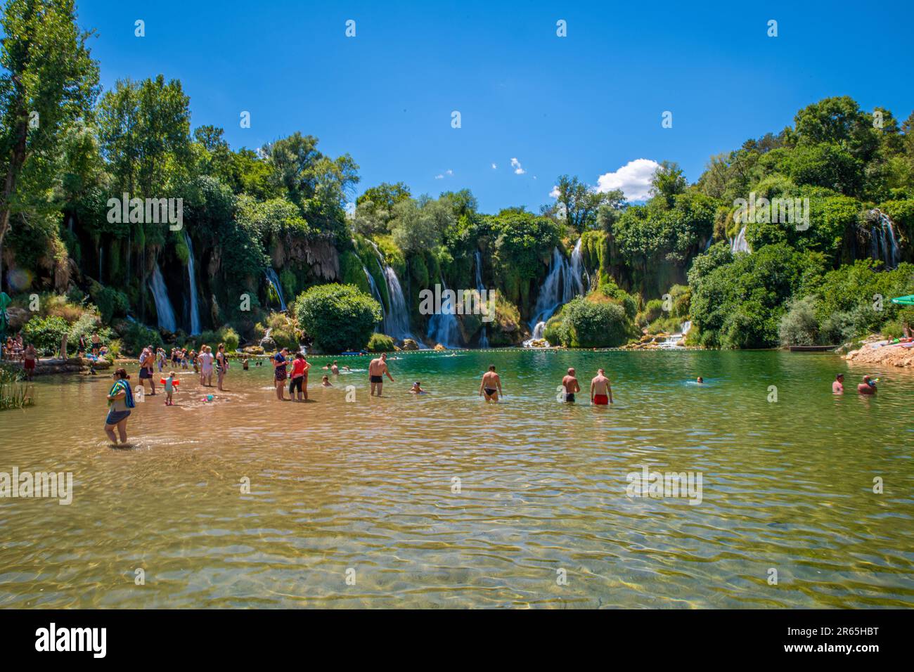 A diverse group of people smiling and laughing as they frolic in the ...