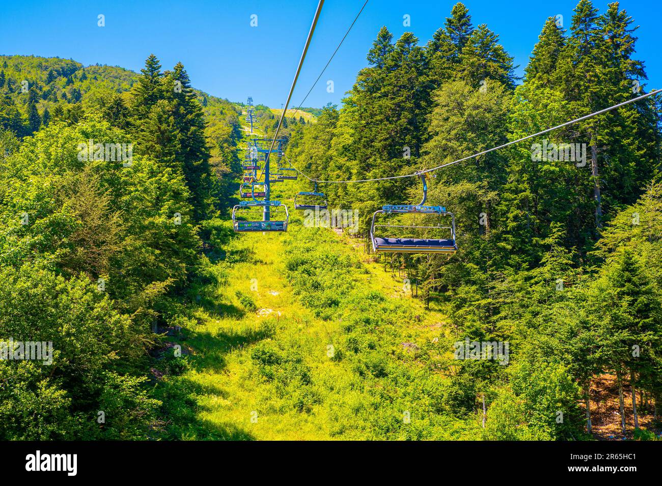 An aerial view of a scenic ski resort in the mountains, featuring a ...