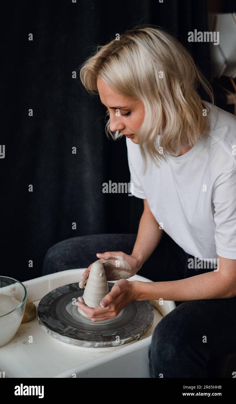 ceramist works behind a potter's wheel Stock Photo - Alamy