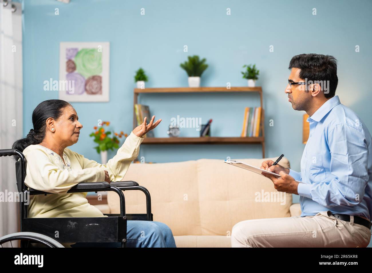 Indian psychologist at home counseling elderly senior woman sitting on ...
