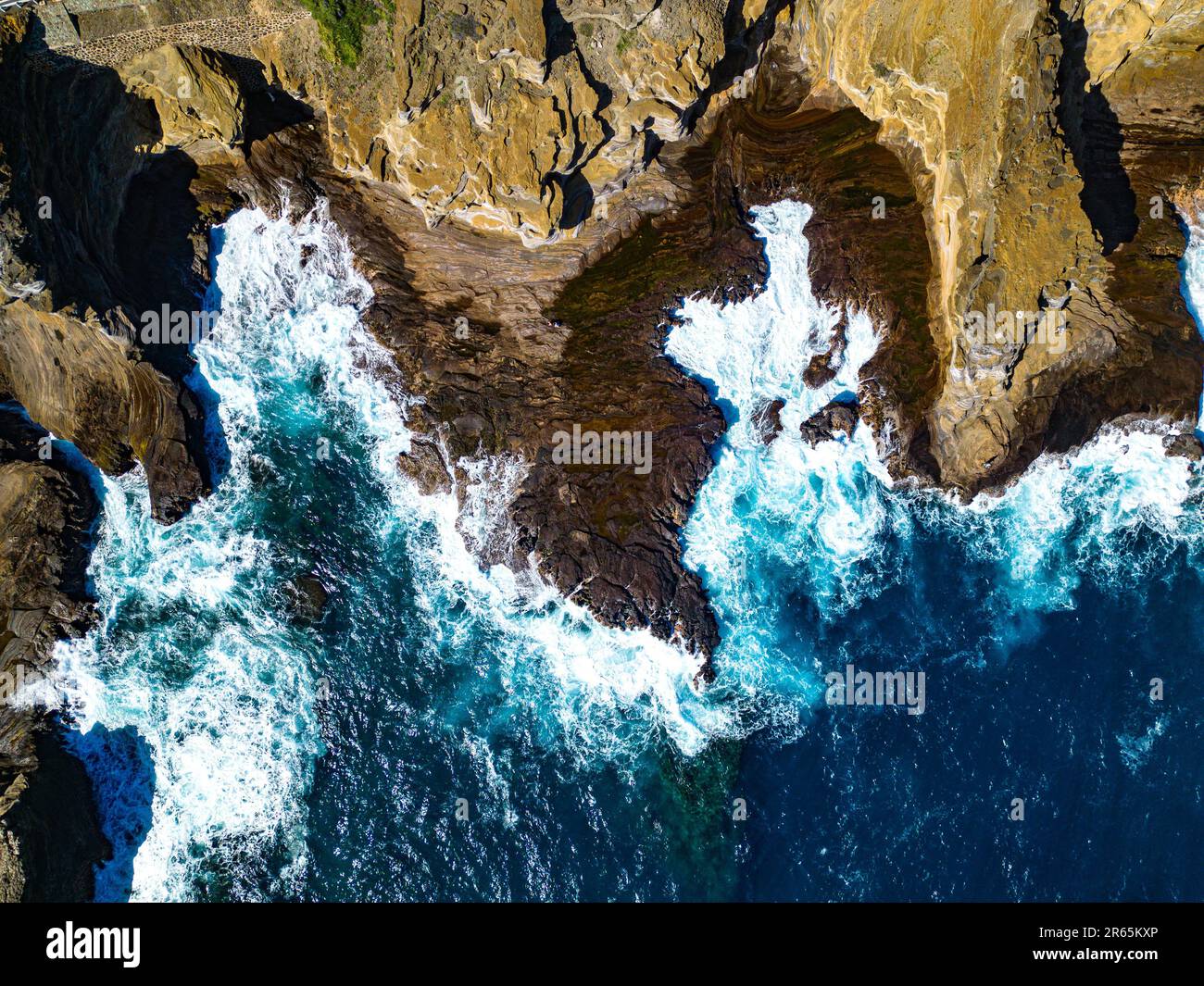 An aerial view of the stunning East Coast shoreline cliffs of O'ahu ...
