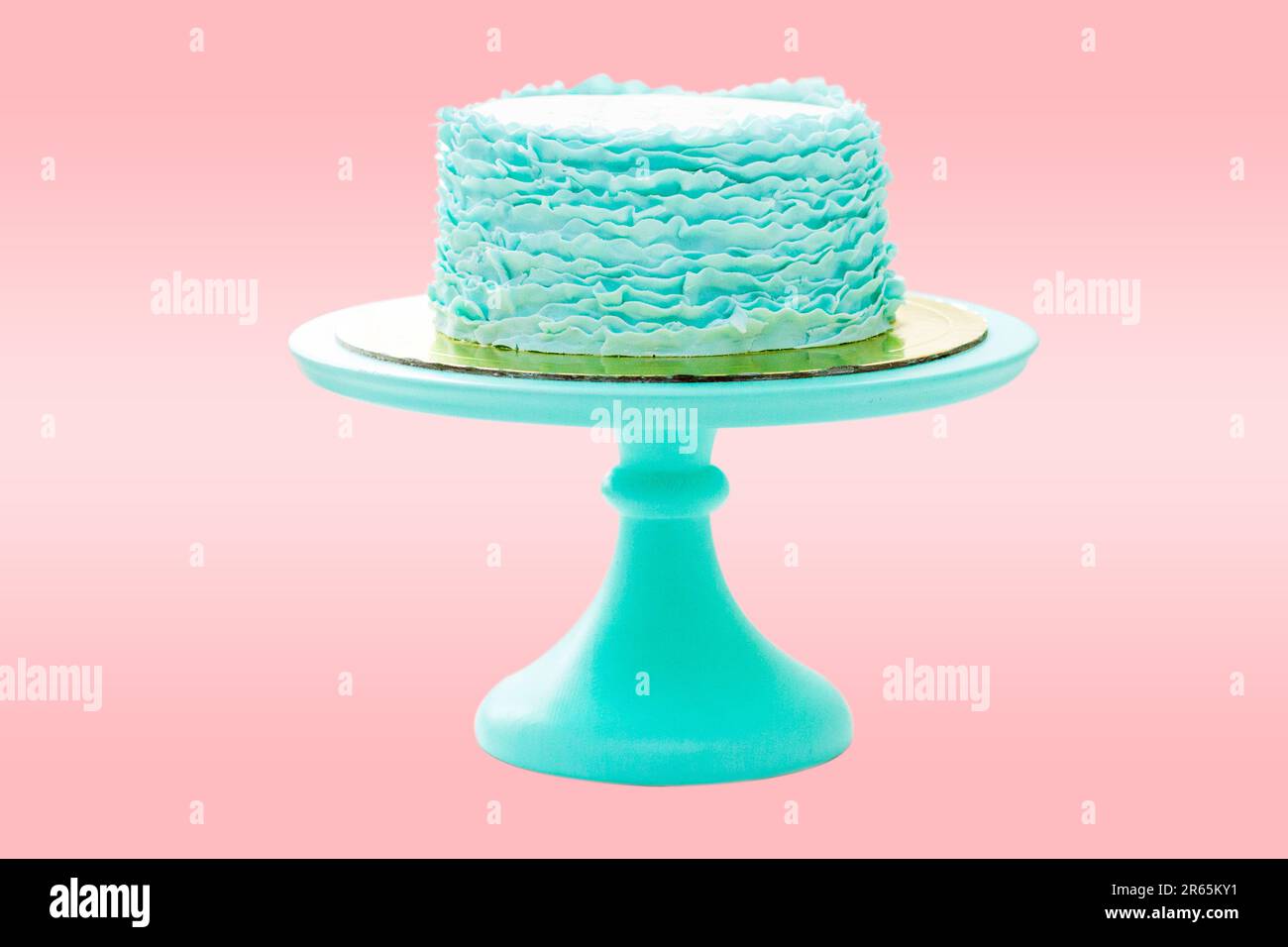 Green elegant birthday cake with fondant ruffles isolated on backgrund ...