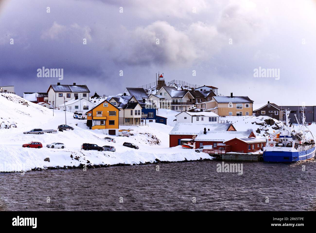 The harbour at Honningsvag, Norway, in winter after snow fall. It's a ...