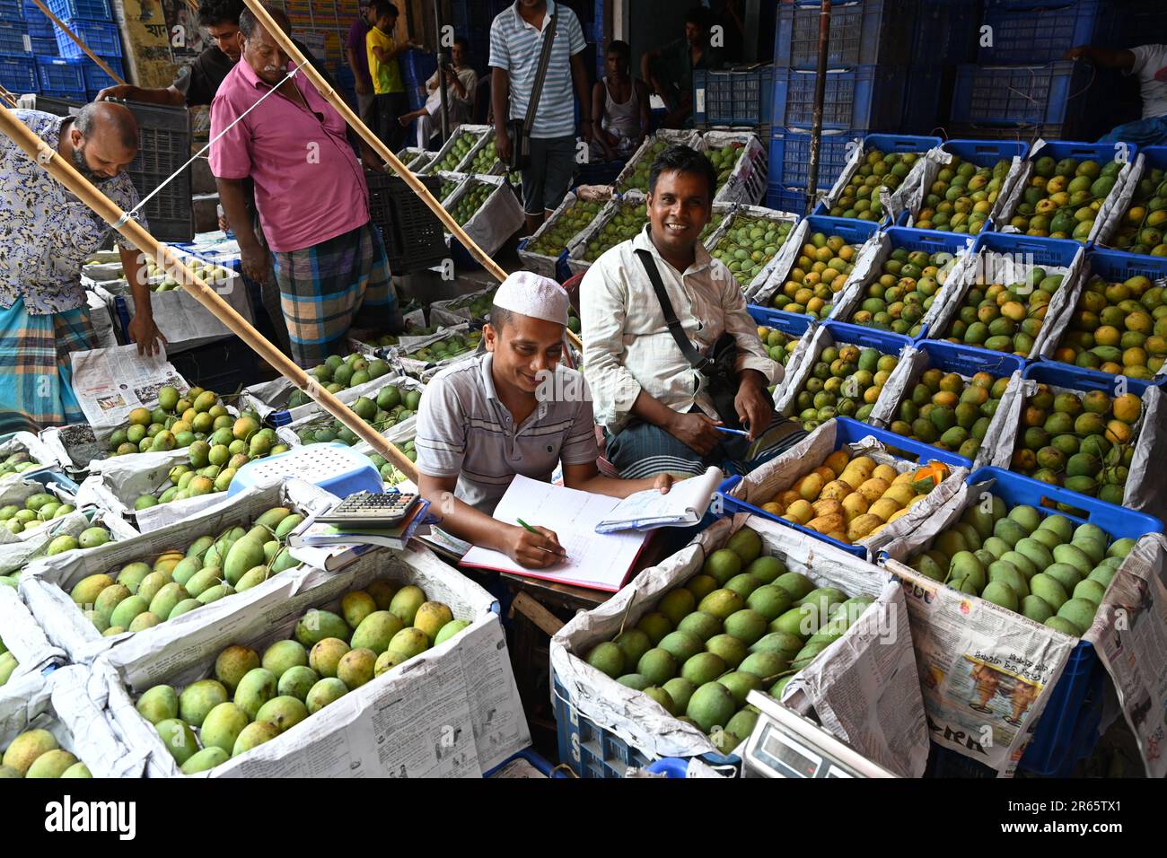 Dhaka, Bangladesh, on June 7, 2023 , Fruit traders displayed Mangos for sale at the wholesale ...