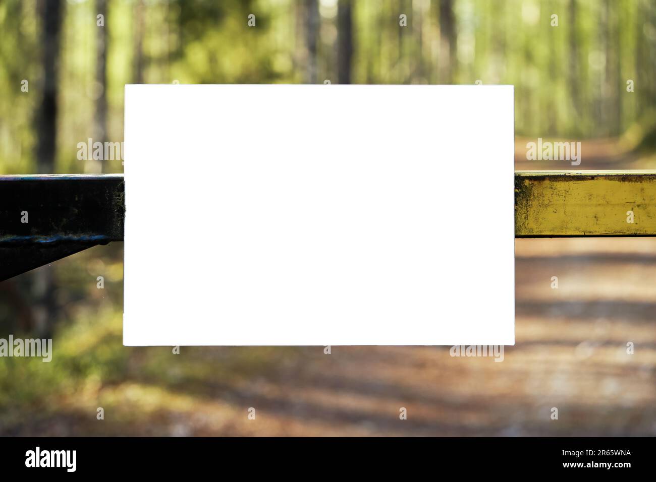 Empty white sign attached to a boom barrier in a forest road Stock ...