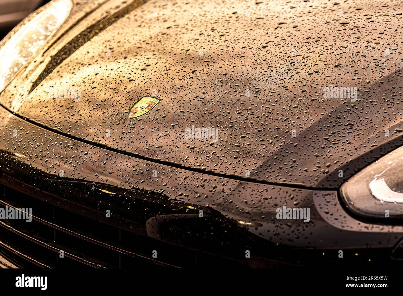 Masi, Italy 7 june 2023: Luxurious black car with waterdrops covering ...