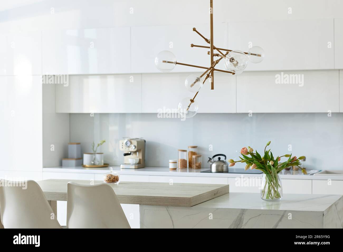 Horizontal image of white bright kitchen with modern design Stock Photo ...