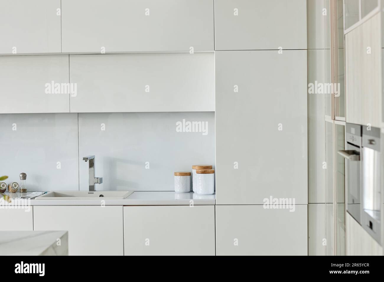 Horizontal image of white bright kitchen with beautiful design and big ...