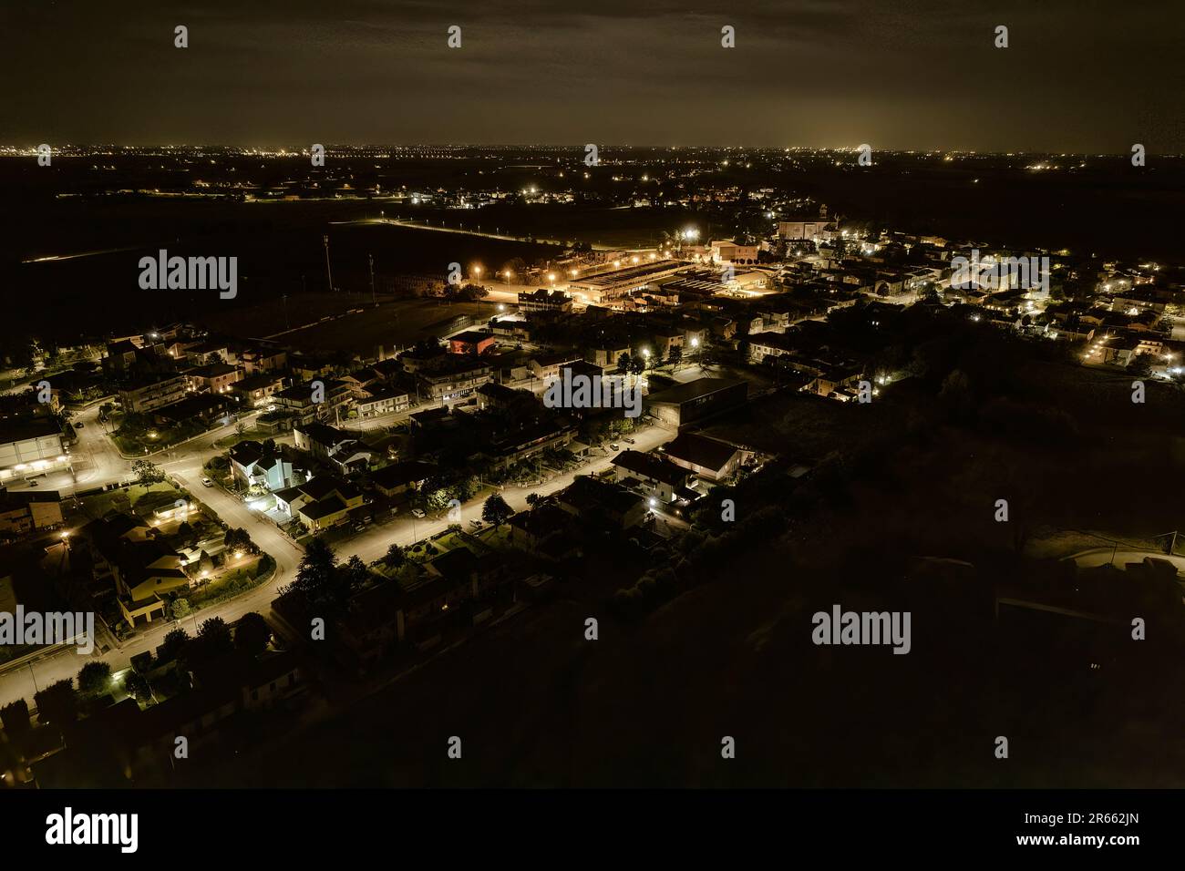 Aerial view of a town at night, with street lights creating an ...