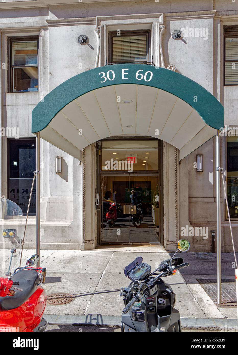 Entrance to 30 East 60th Street, an Emery Roth-designed residential ...