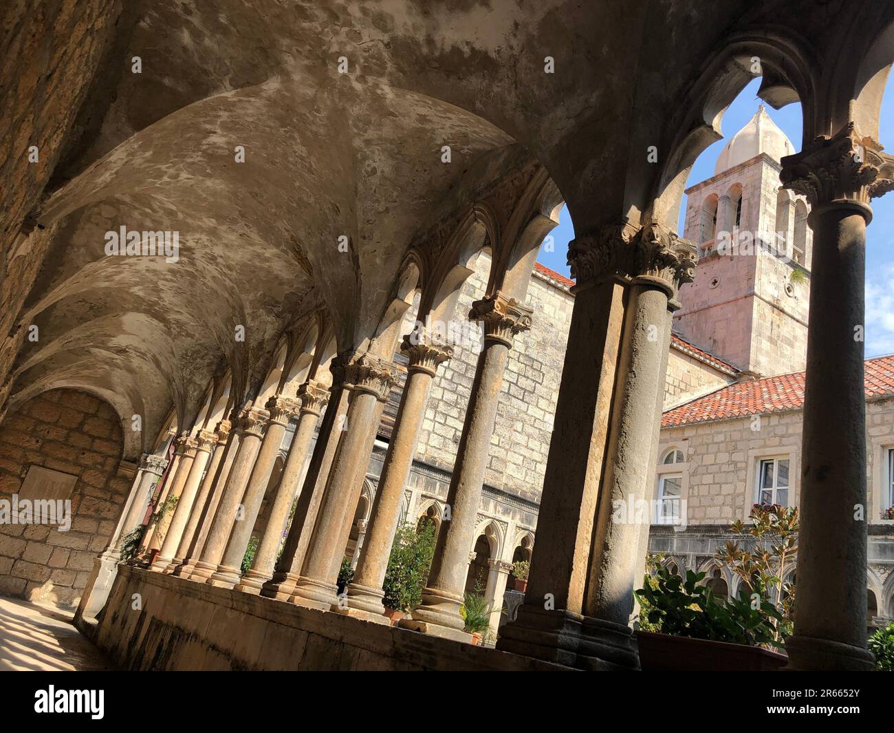 An interior shot of a Franciscan monastery with an arched pathway Stock ...