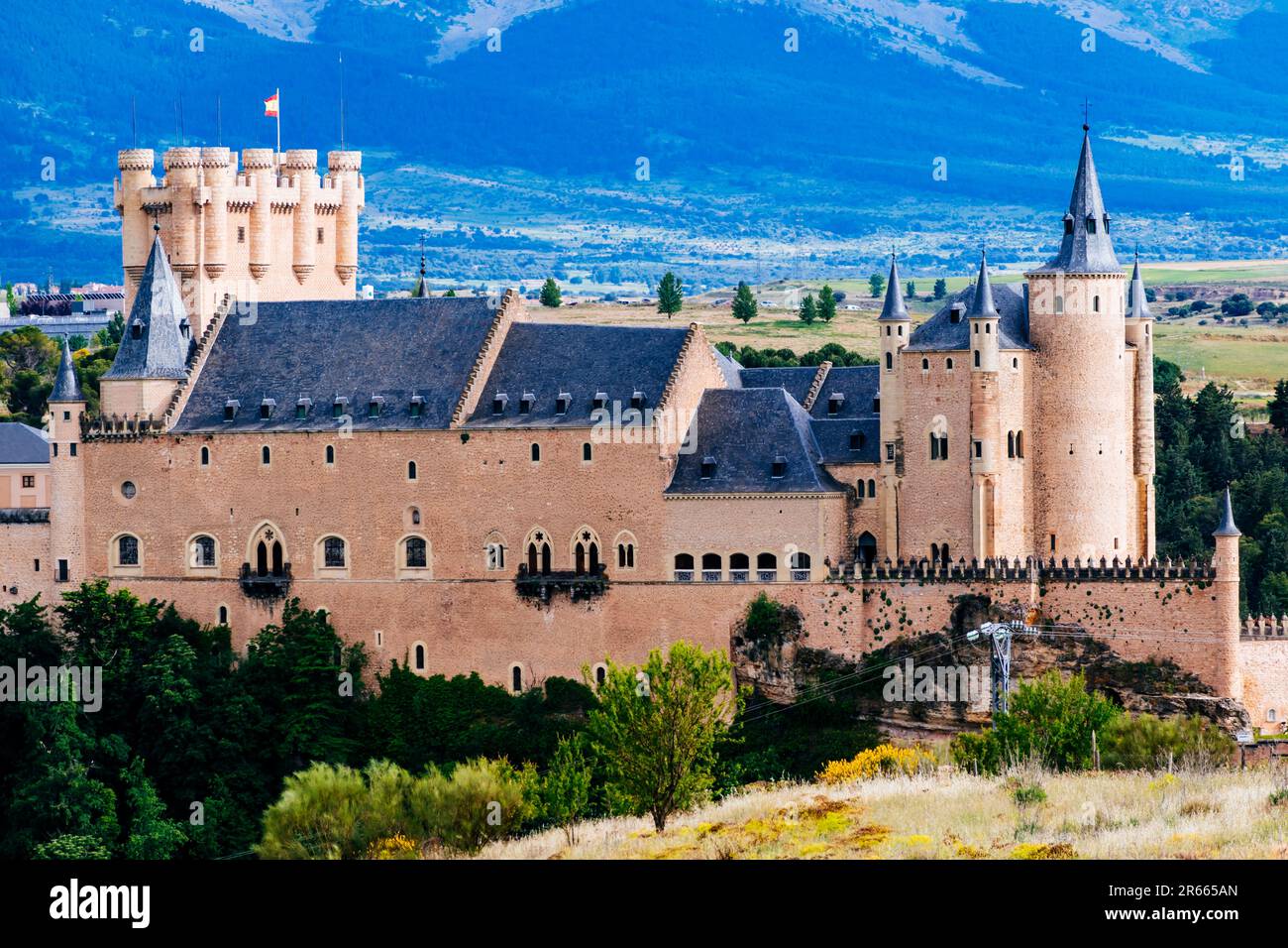 The sunset sun over the Tower of John II of Castile. Alcázar of Segovia ...