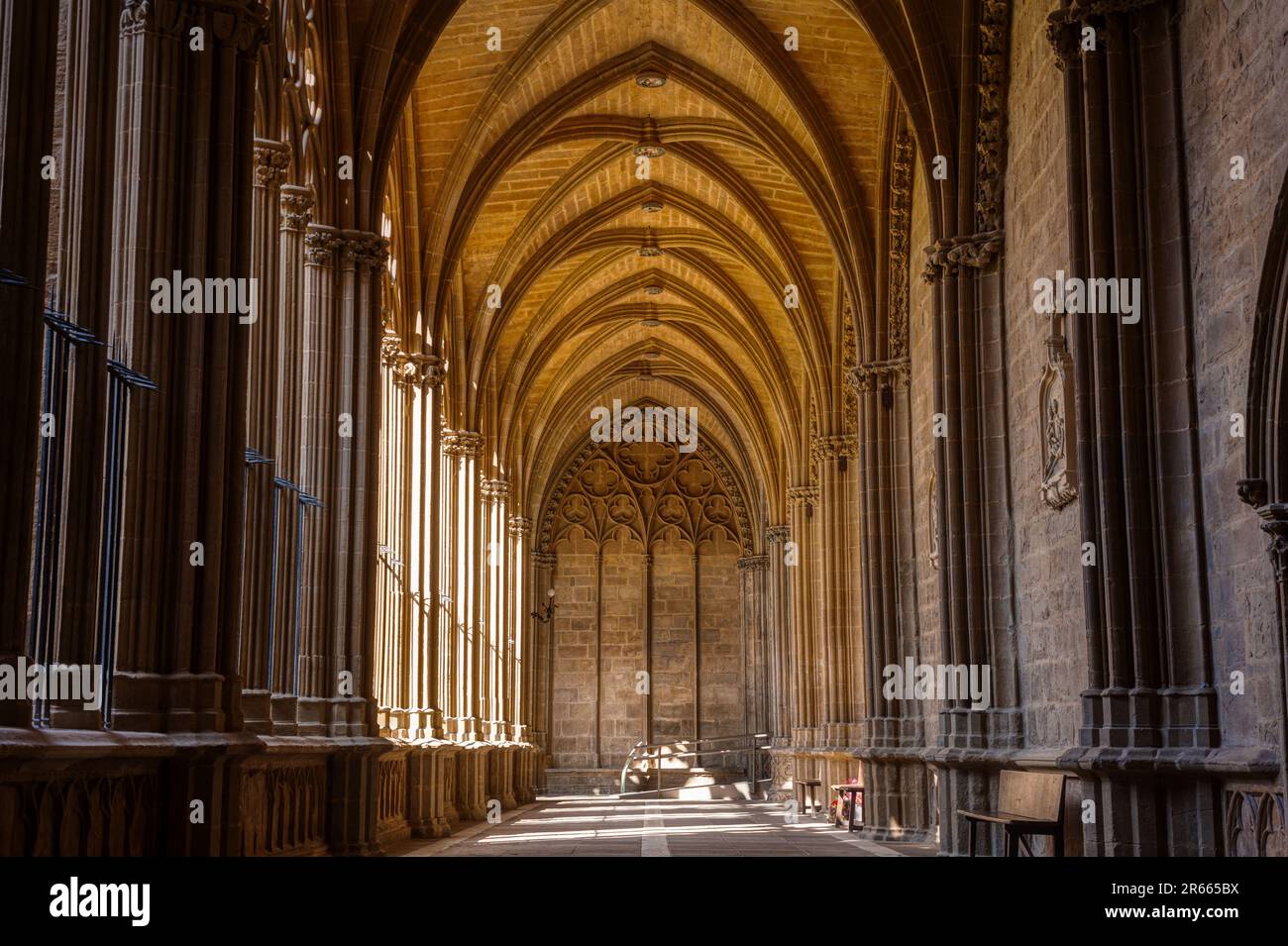 View of the ornate gothic cloister arcade arches of the Catholic ...