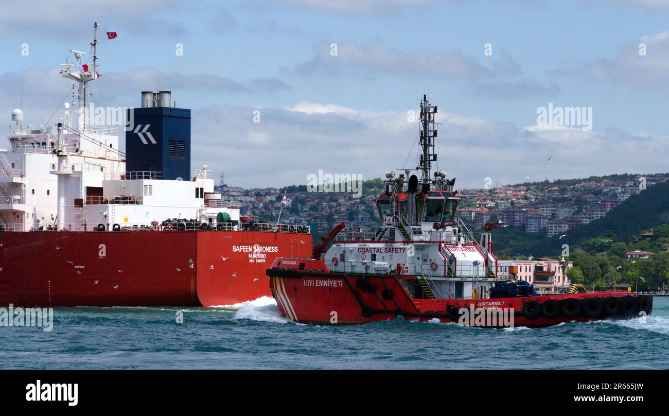 A large ship, the Safeen Baroness oil tanker, goes upstream in the ...