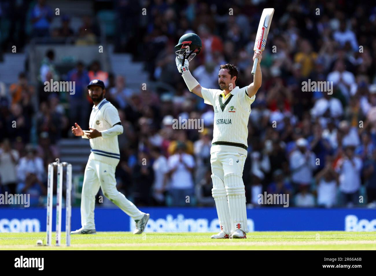Australia's Travis Head (right) celebrates reaching a century during ...