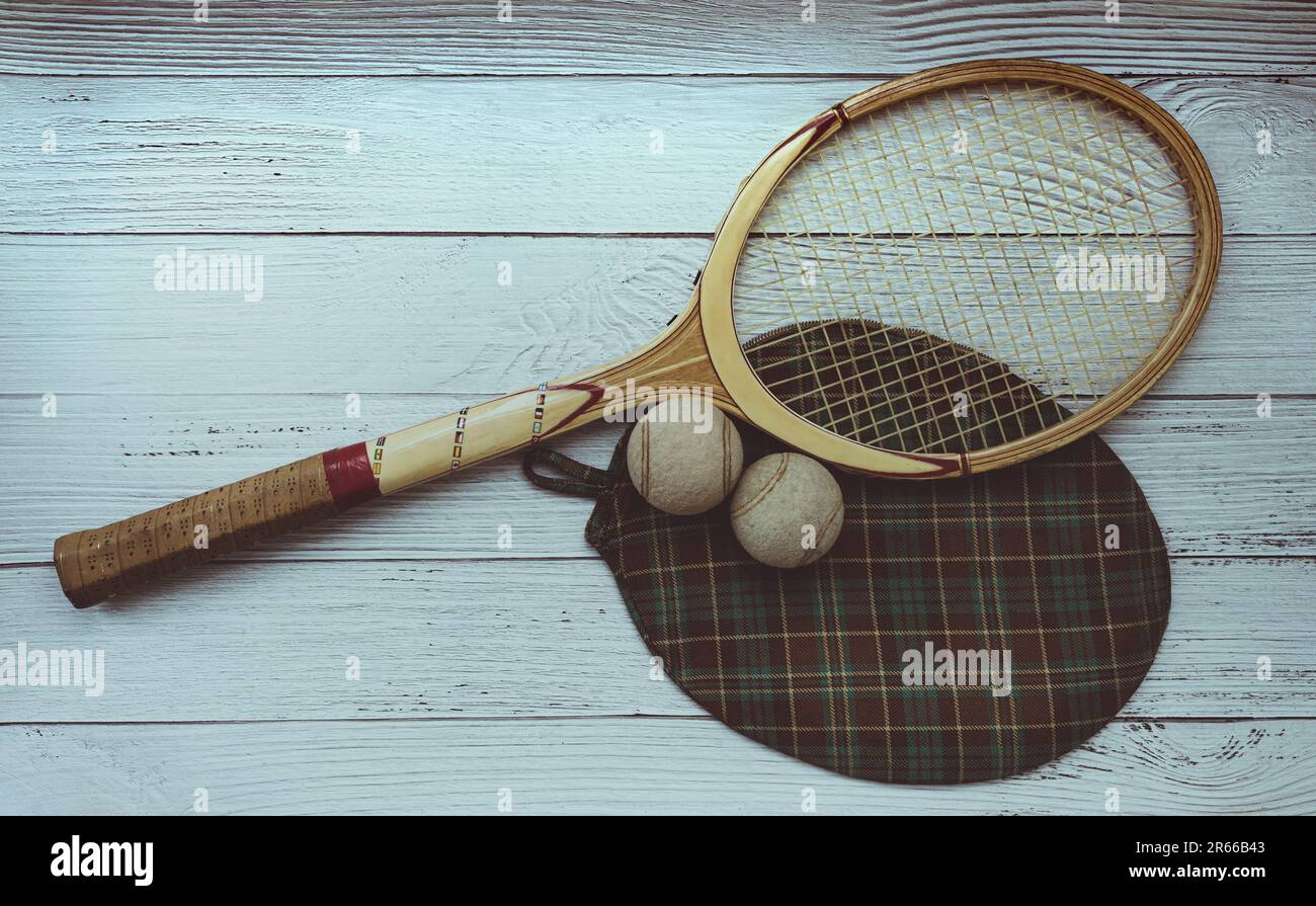 A vintage tennis racket with balls on wood background Stock Photo - Alamy