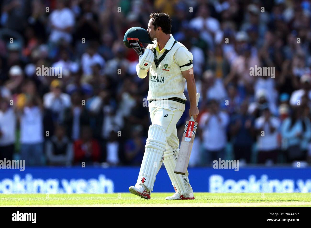 Australia's Travis Head celebrates reaching a century during day one of ...
