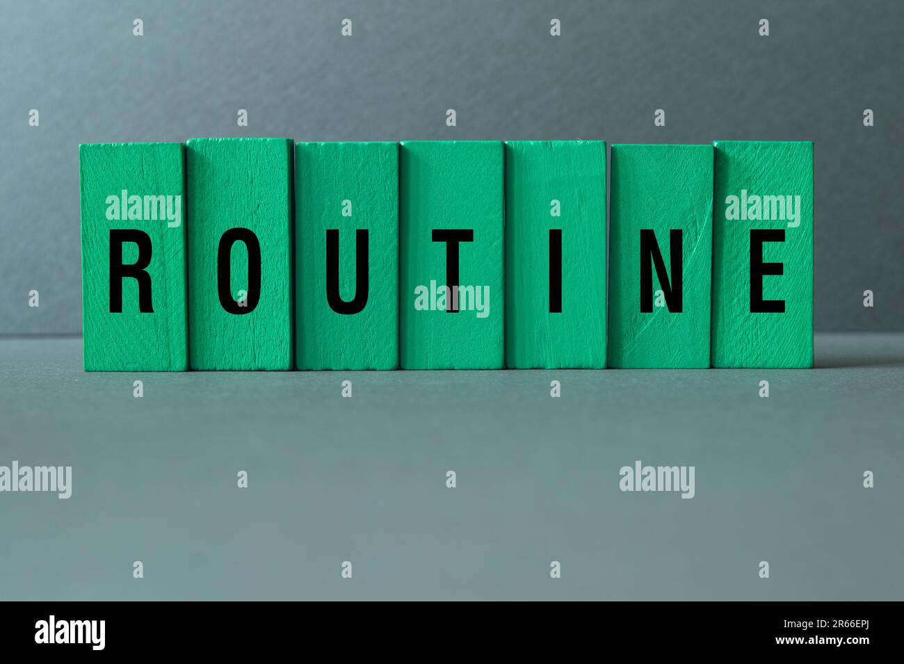 Routine - word concept on building blocks, text Stock Photo - Alamy