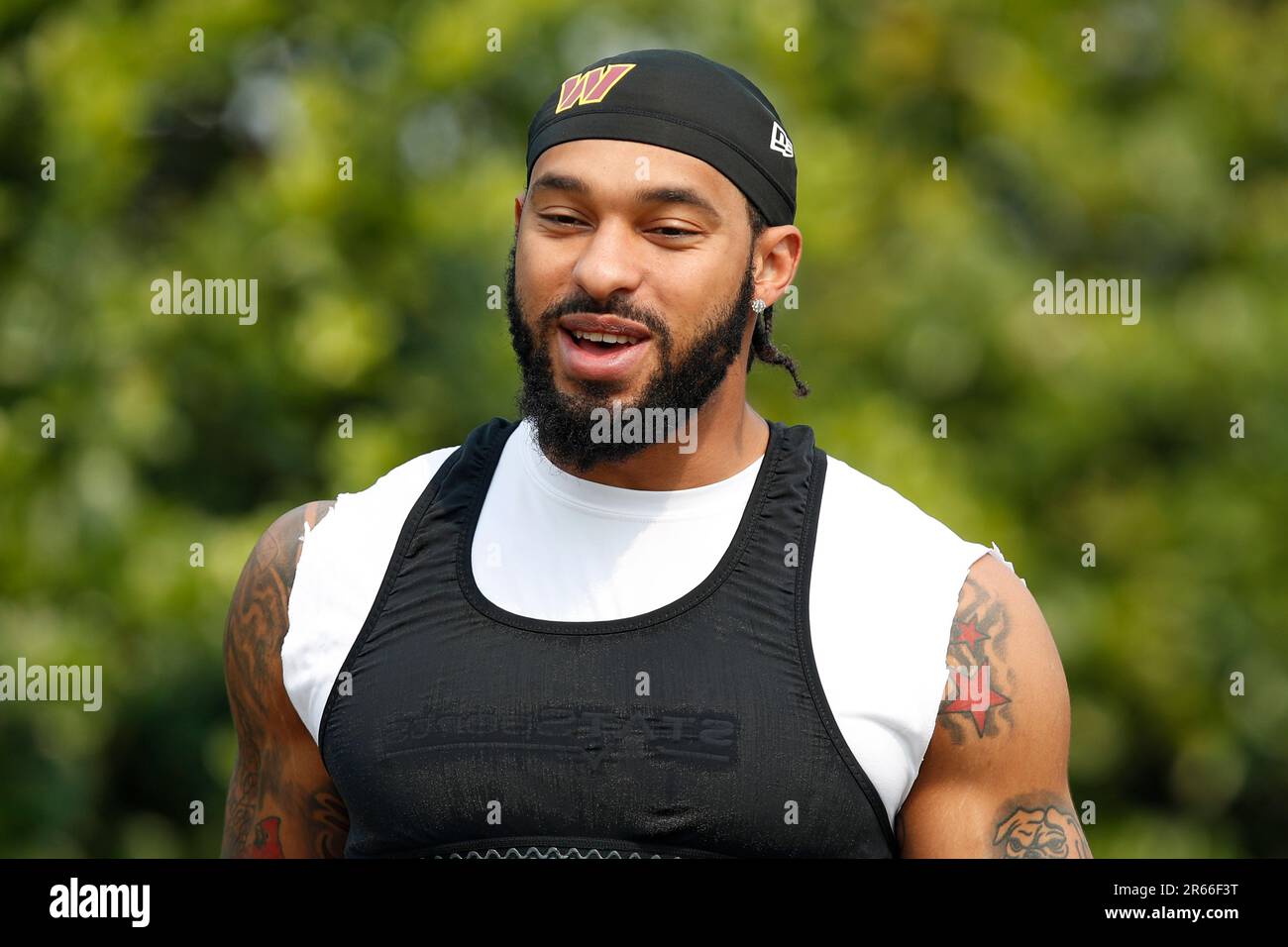 Washington Commanders defensive end Montez Sweat walks to the field ...