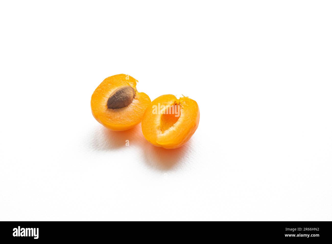 Deliciously vibrant yellow-orange apricots, half apricot with pip ...