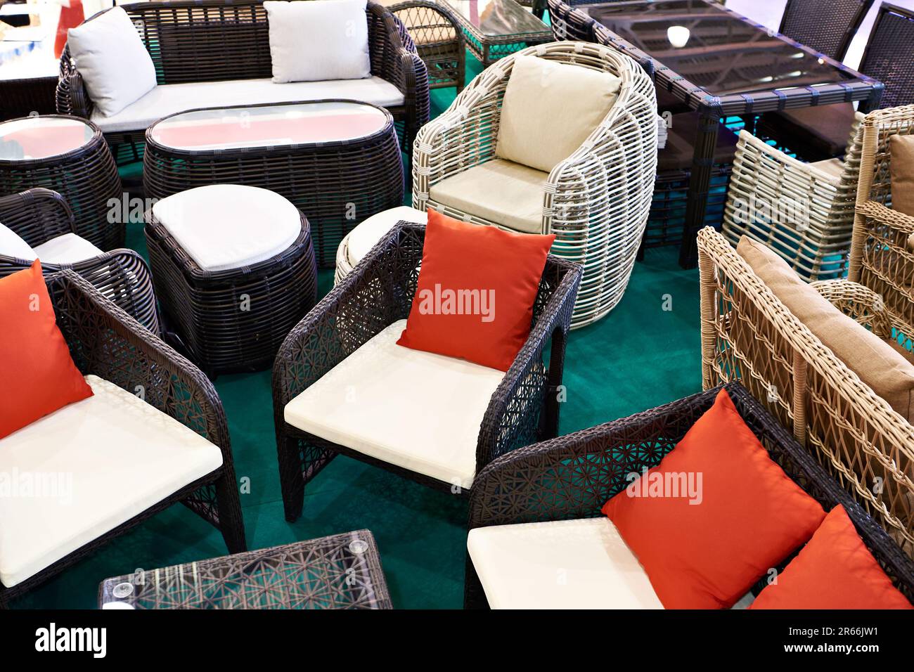 Wicker furniture tables and chairs at the exhibition Stock Photo - Alamy