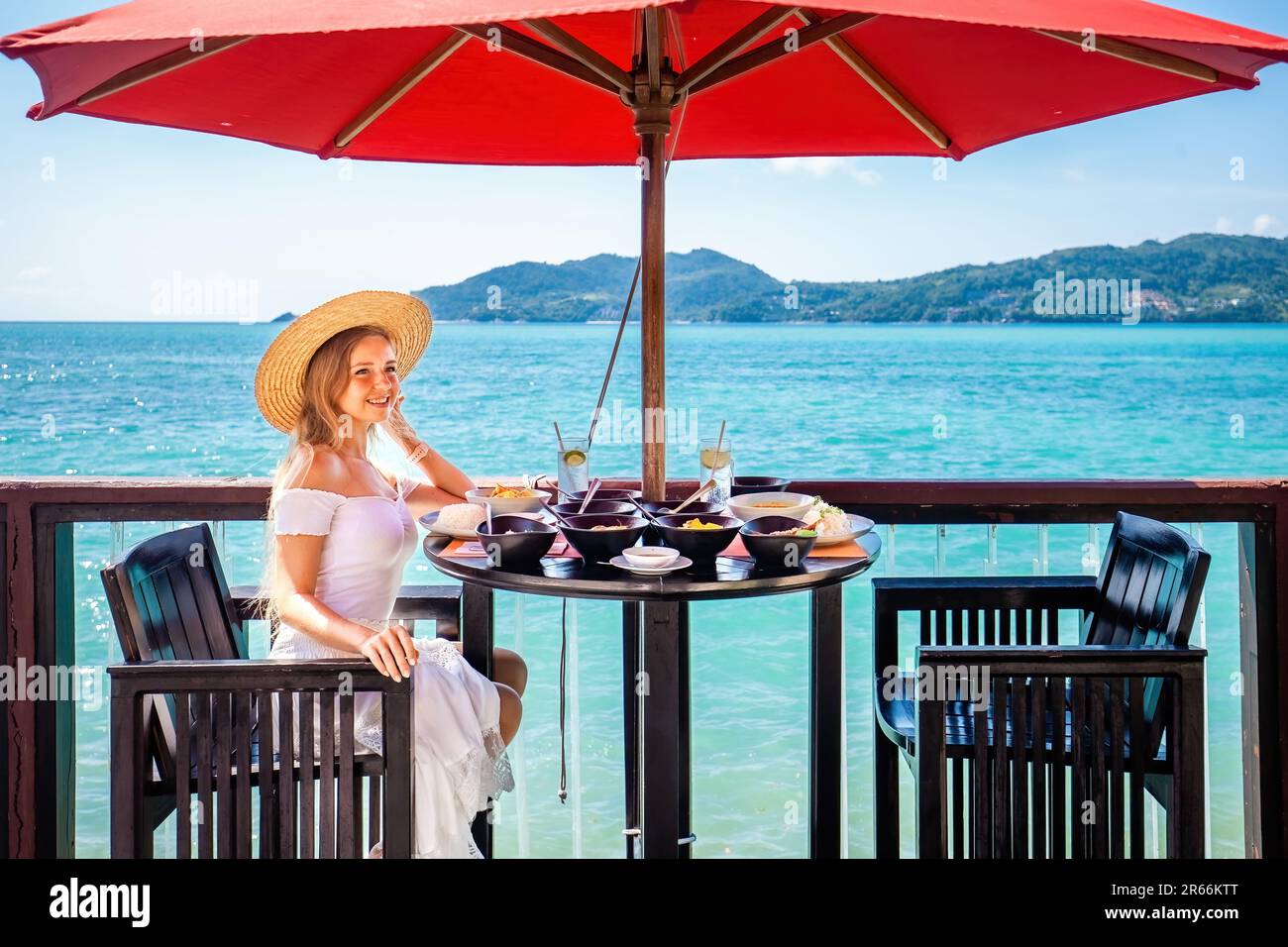 Young woman enjoys a delicious lunch in a luxury hotel resort Stock ...
