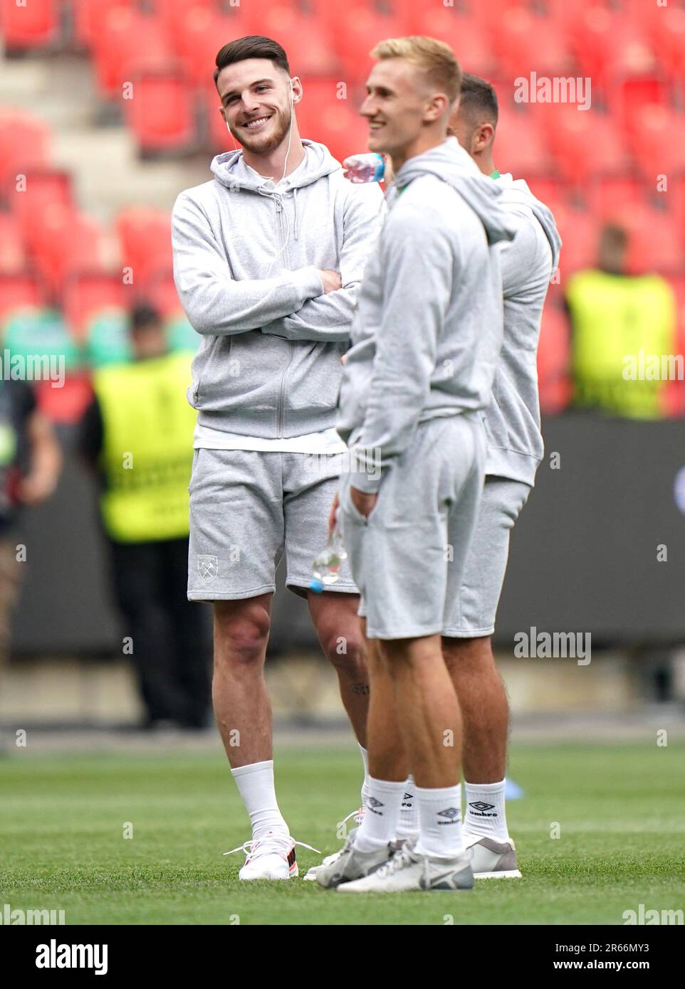 West Ham United's Declan Rice (left) and team-mates inspect the pitch ...