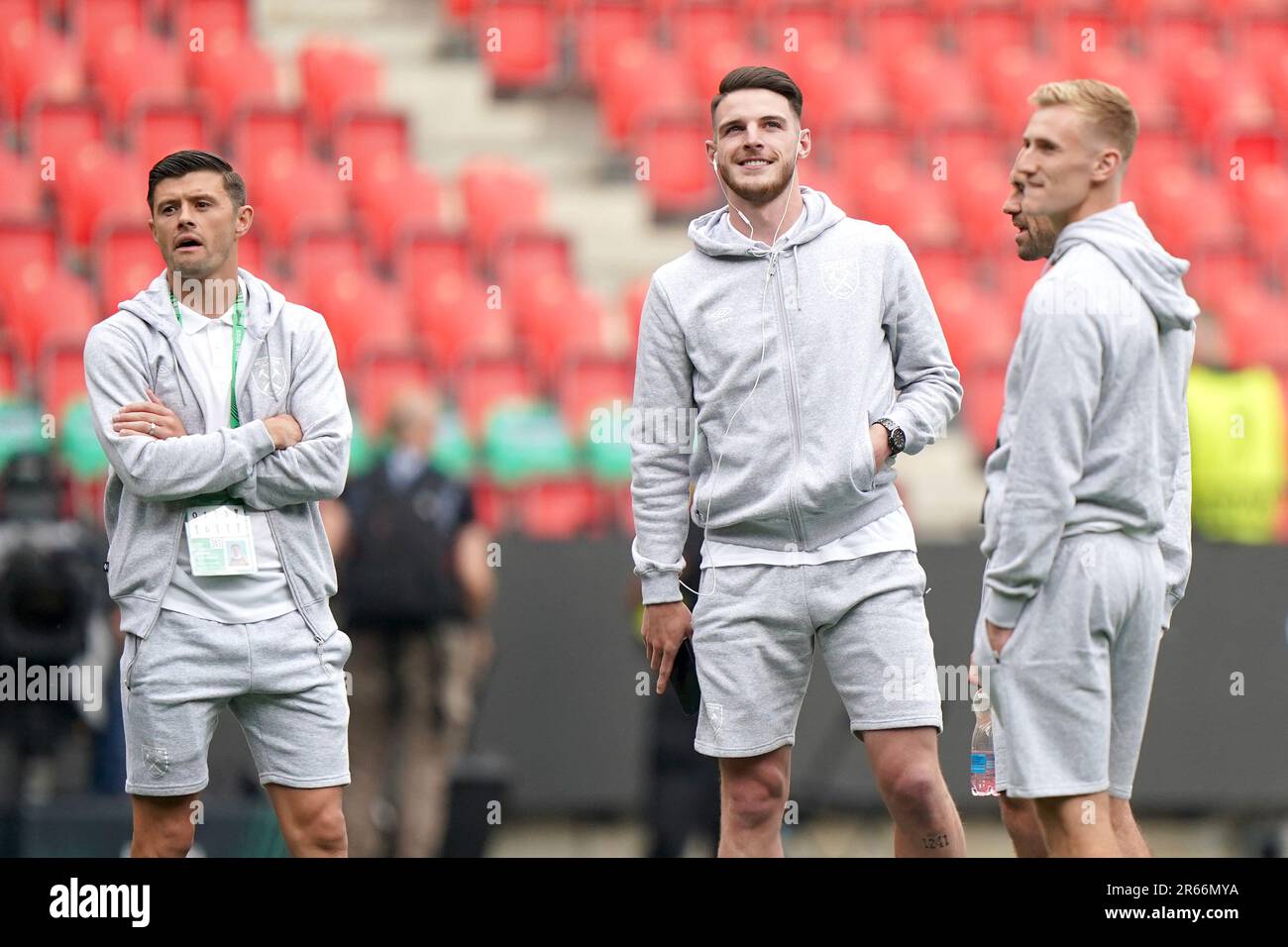 West Ham United's Declan Rice (centre) and team-mates inspect the pitch ...