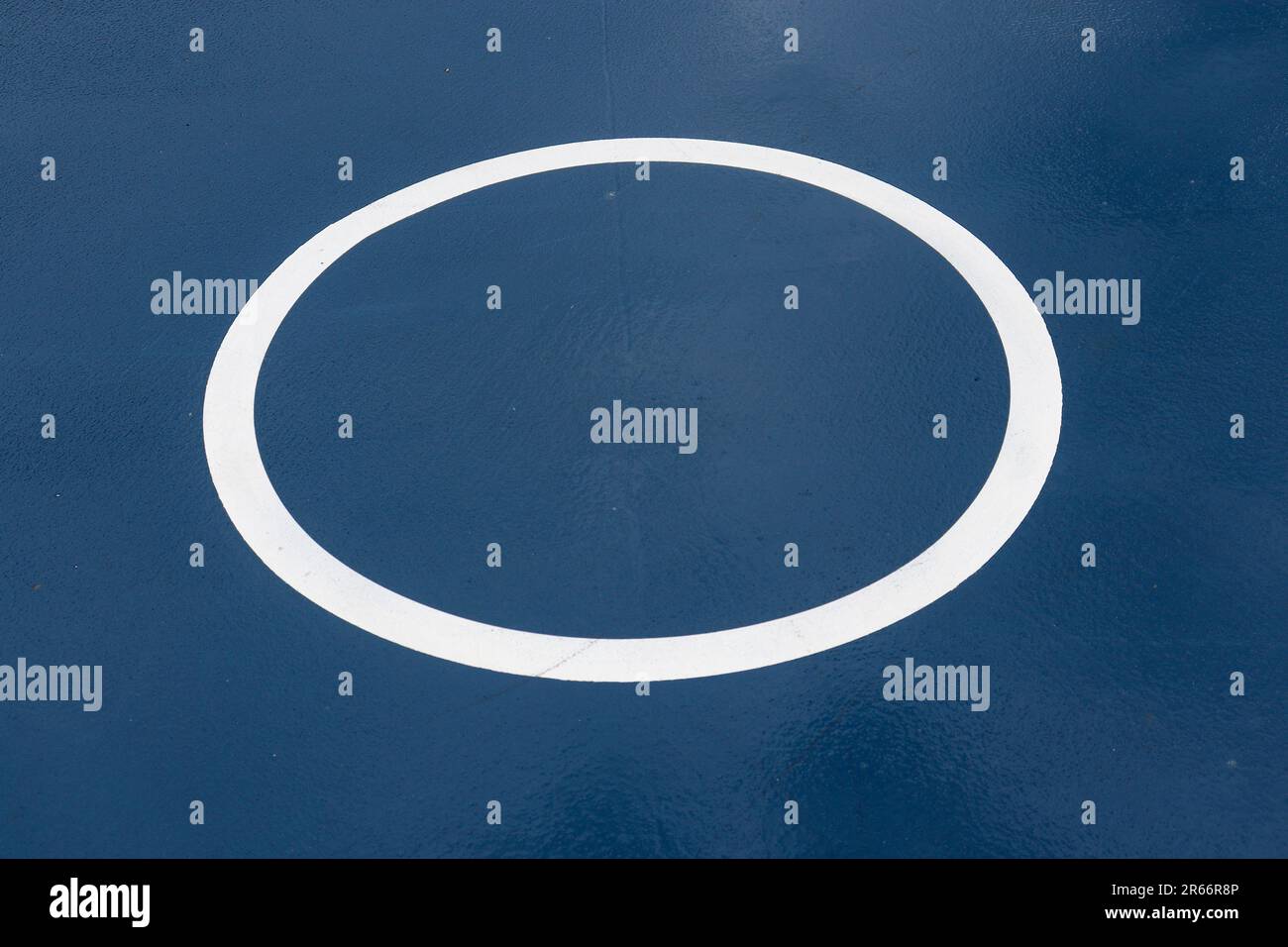 A blue road sign featuring a circular arrow symbol, indicating ...