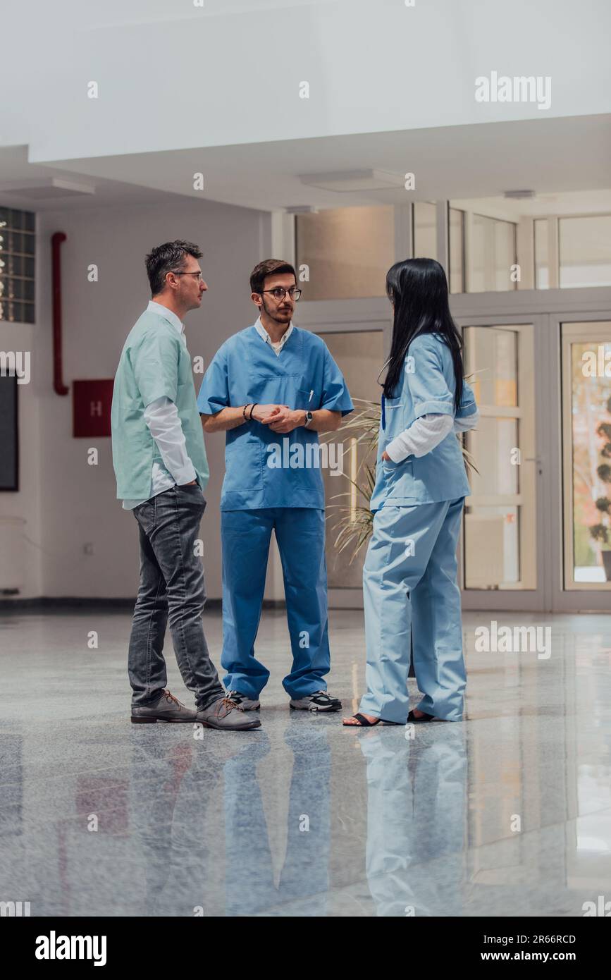 A nurse, medical technician, and doctor engage in a discussion on ...