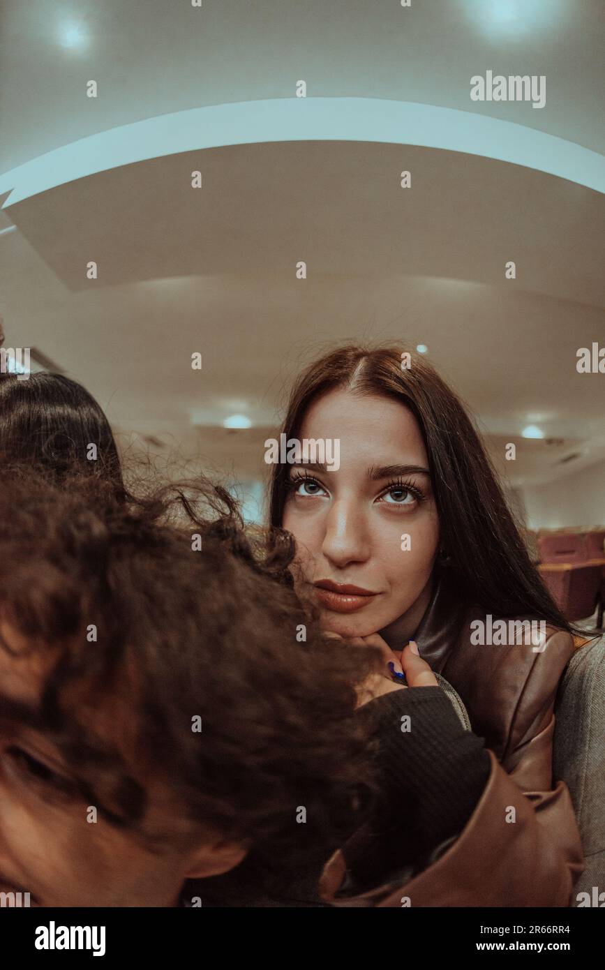 A diverse group of friends with terrified expressions together in a ...