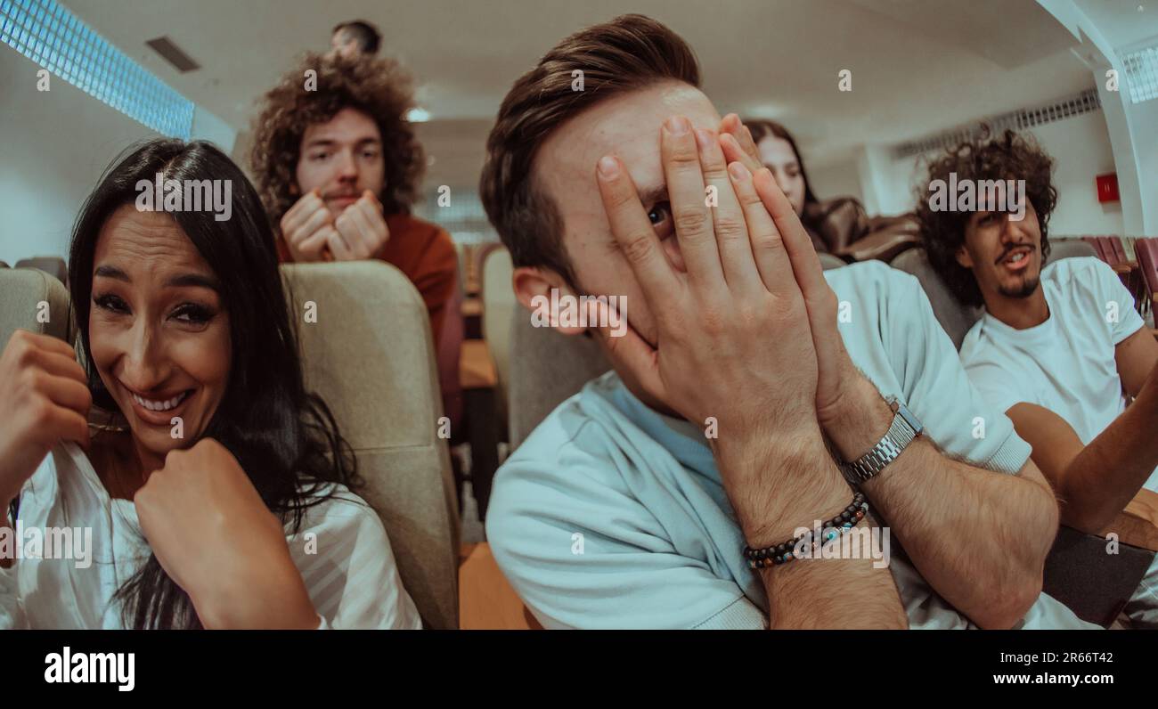 A diverse group of friends with terrified expressions together in a ...