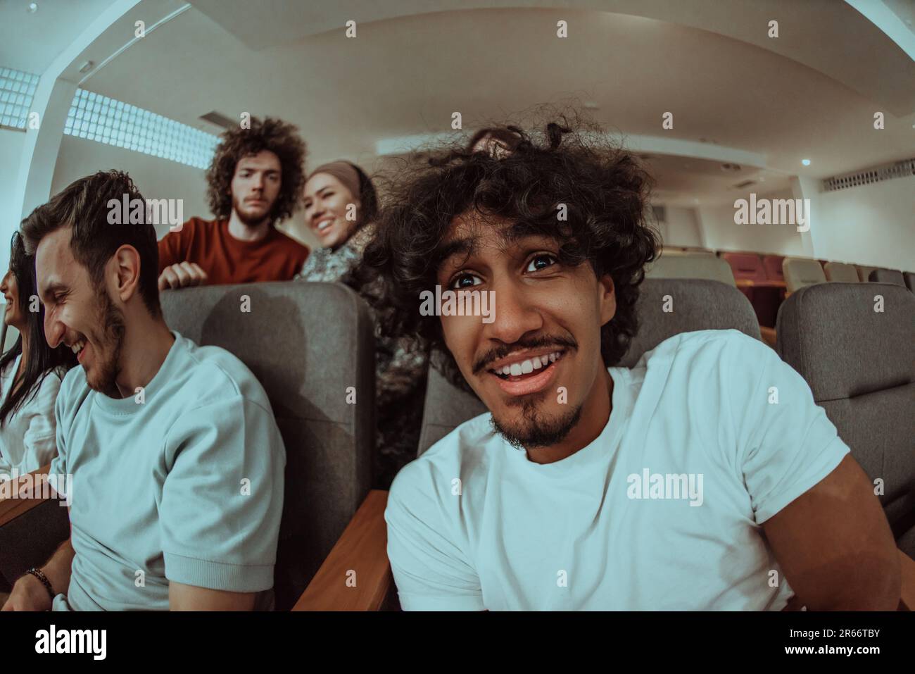 A diverse group of friends with terrified expressions together in a ...