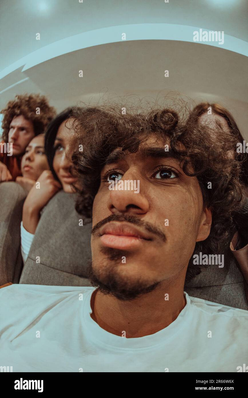 A diverse group of friends with terrified expressions together in a ...