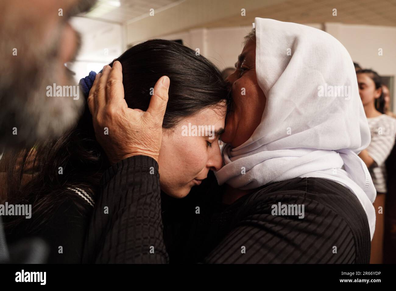 Duhok, Iraq. 07th June, 2023. Samia Smo (L), 29, is greeted by a family ...