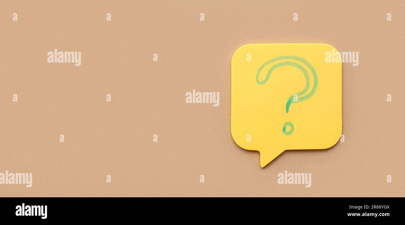 Sticky paper with question mark on beige background with space for text ...