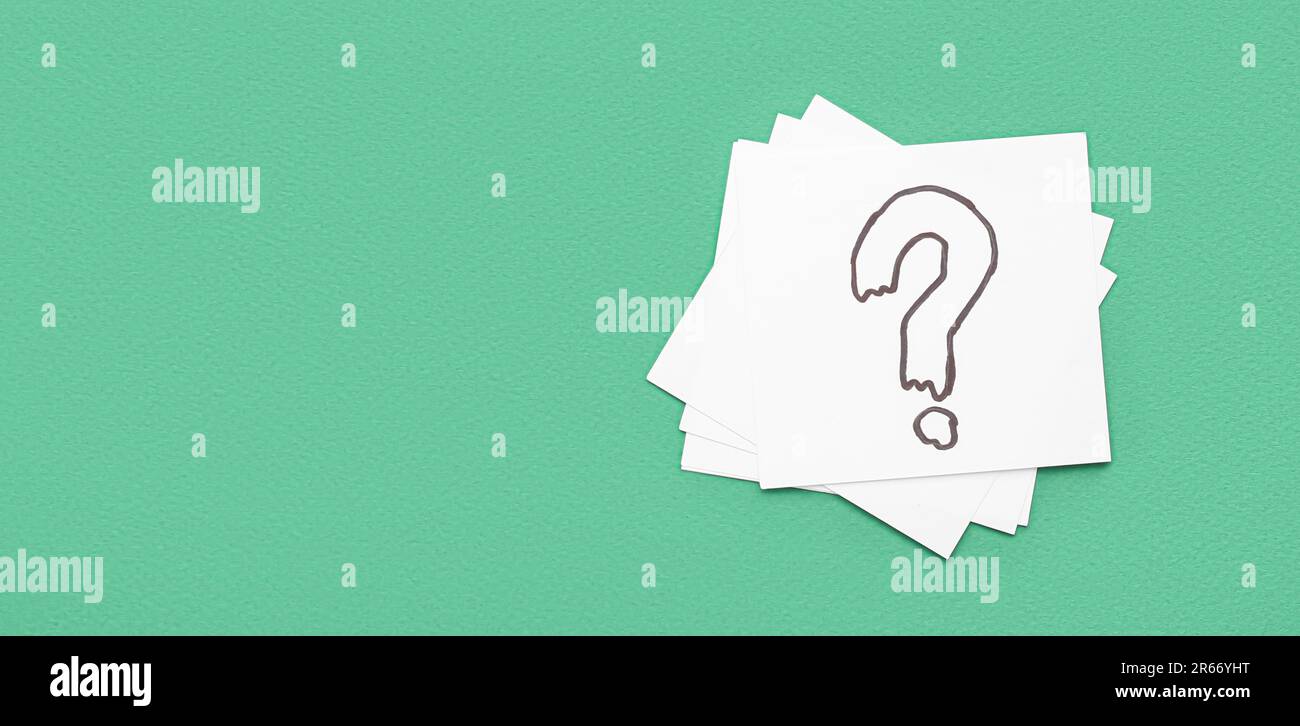 Paper sheet with question mark on green background with space for text ...