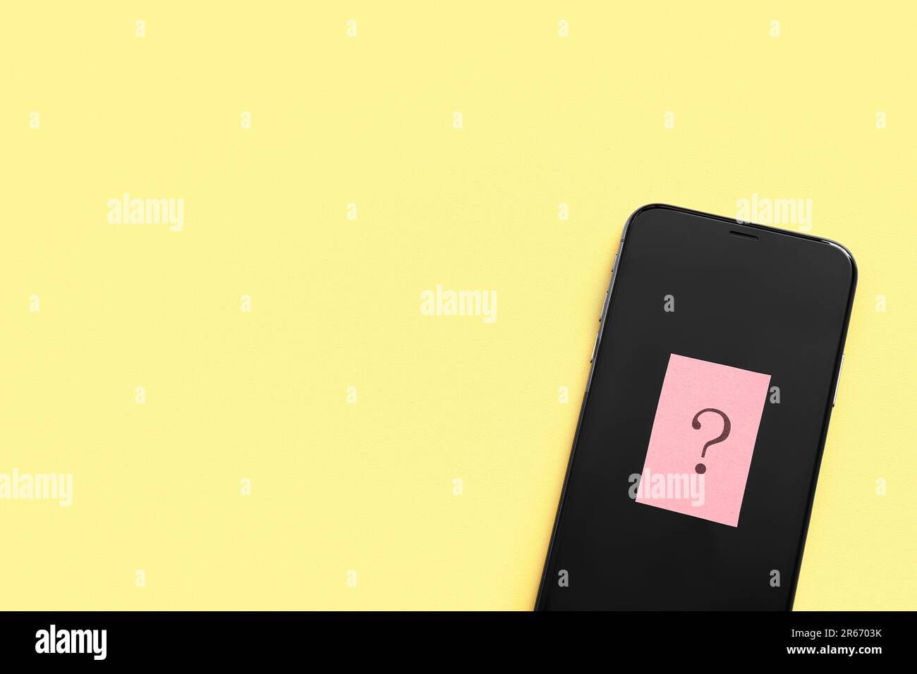Mobile phone with question mark on yellow background Stock Photo - Alamy
